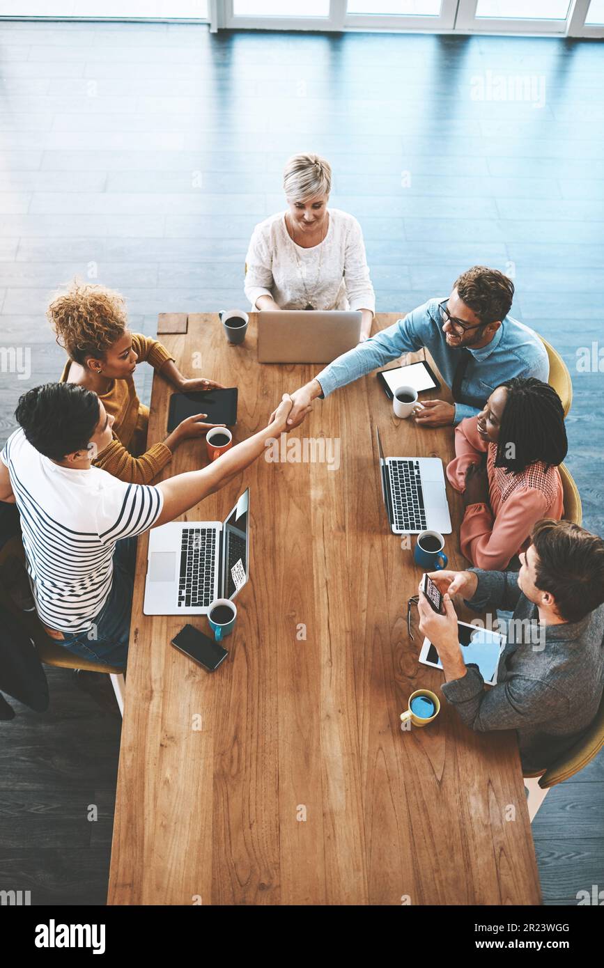 Handshake, above and business people in a meeting at work for ...