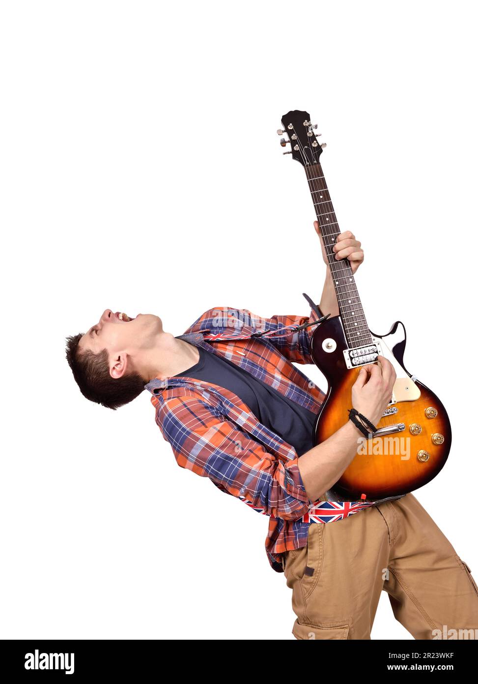 expressive rock musician is playing electrical guitar on white ...