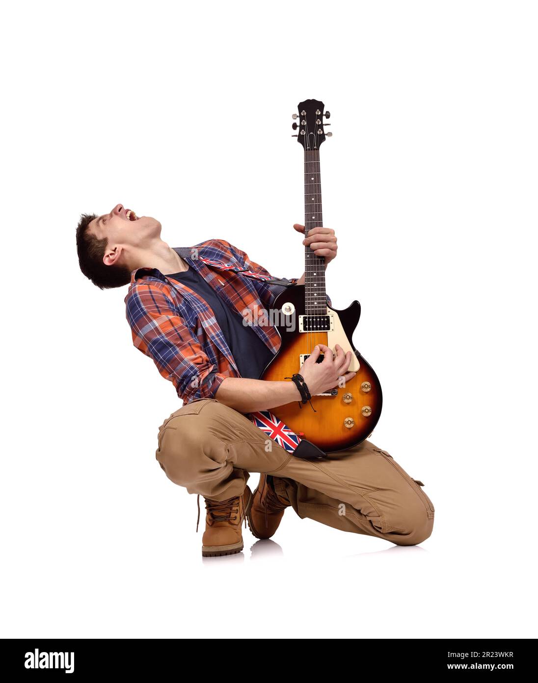happy rocker musician is playing electrical guitar on white background ...