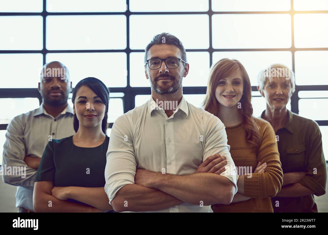 Confidence, leadership and portrait of team with crossed arms in office ...