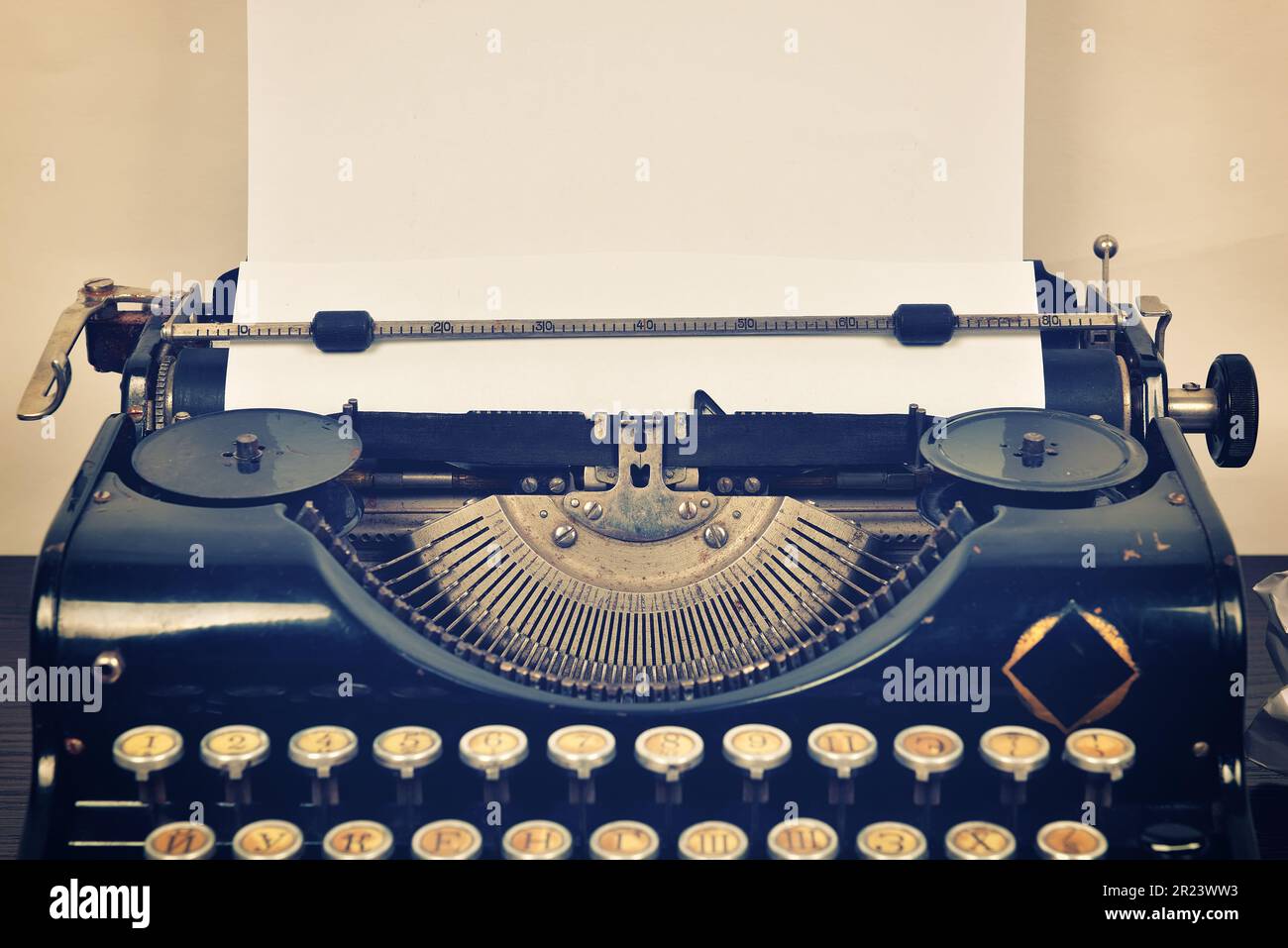 Vintage typewriter with paper on a white background Stock Photo - Alamy