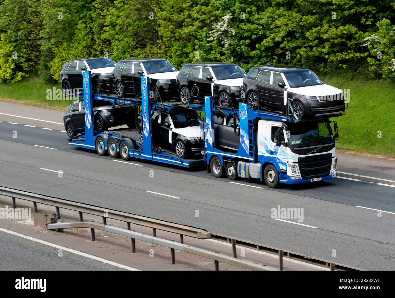 Mobile Services transporter lorry carrying new Land Rover cars on the ...