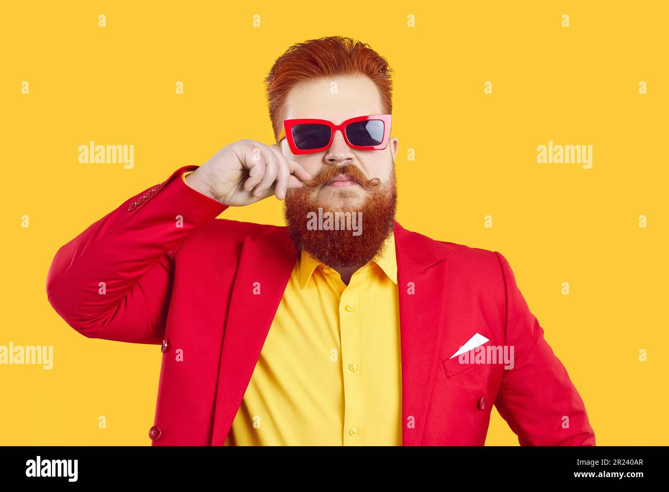 Cool redhead man with mustache posing in suit Stock Photo - Alamy