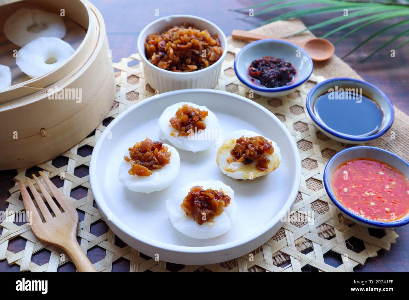 Steamed rice cake top with preserved turnip served with sweet soy sauce ...