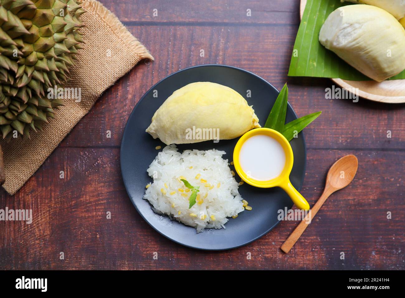 Durian sticky rice topped with mung bean and coconut milk with copy ...