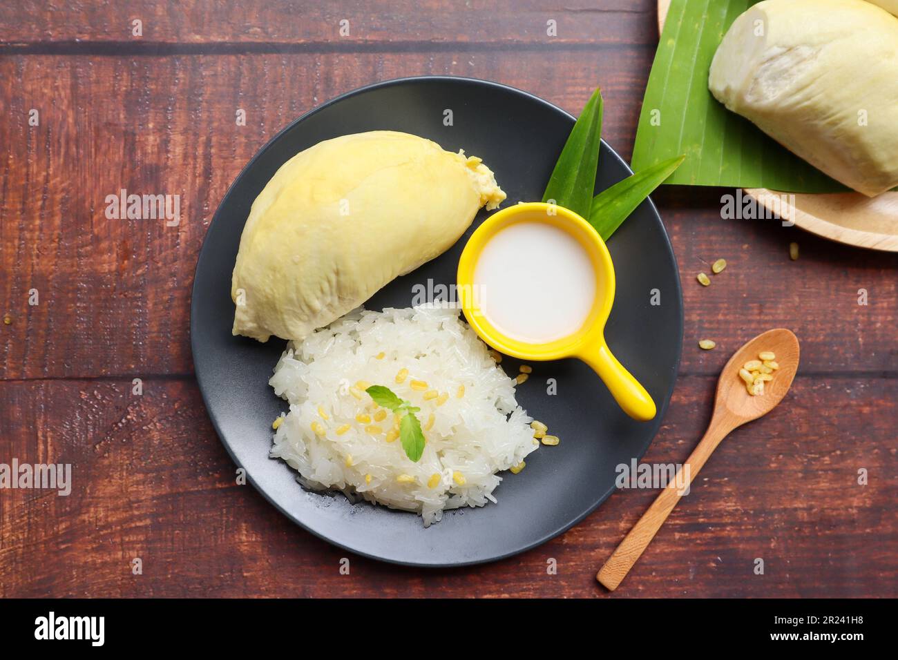 Durian sticky rice topped with mung bean and coconut milk with copy ...