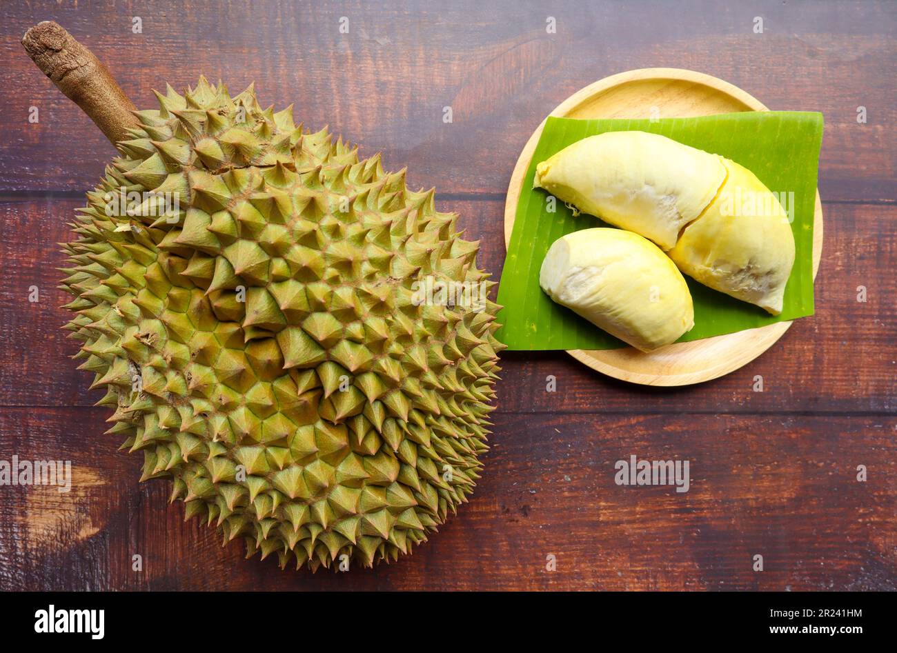 Durian and durian peel serve on wooden dish - Durian is king of ...