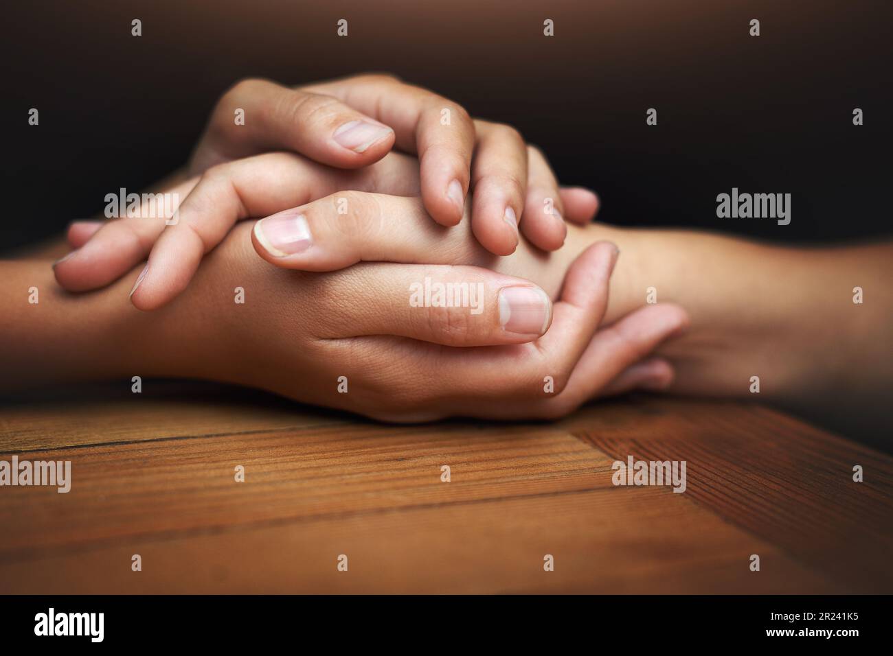 Closeup, love and holding hands for support, comfort and care with ...