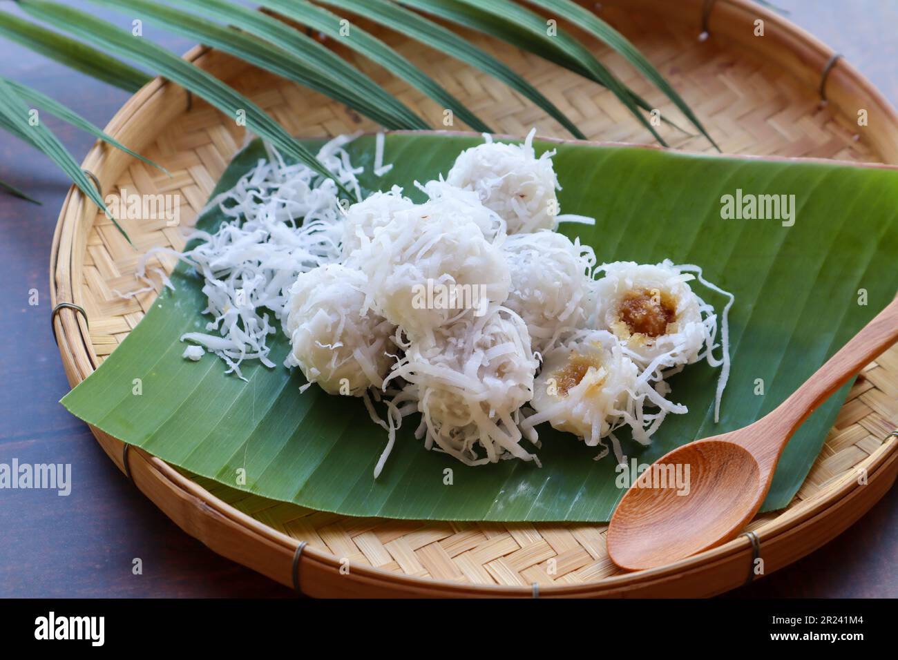 Kanom Tom - Thai dessert of boiled rice flour dumpling coated with ...