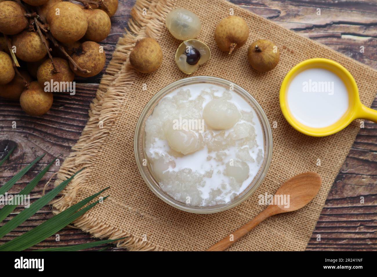 Sticky rice boiled in syrup with longan and coconut milk dressing on ...