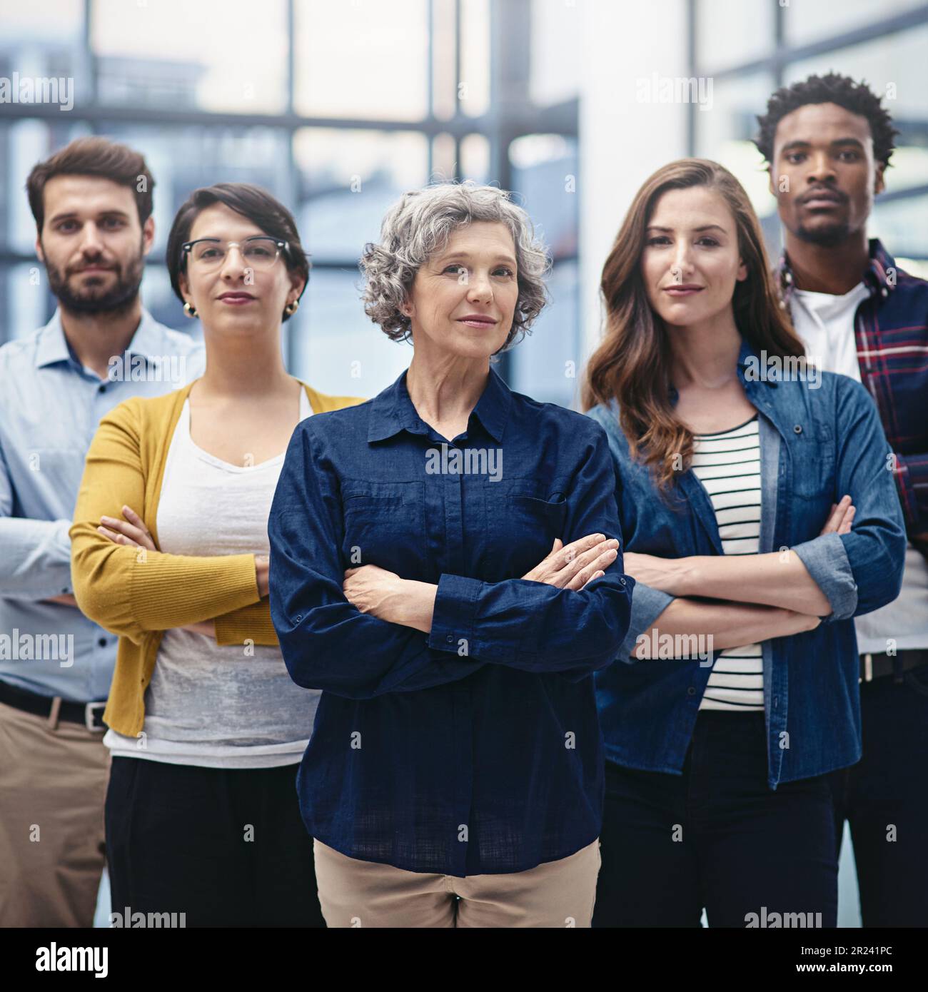 Team, leadership and portrait of business people with crossed arms in the office with confidence ...