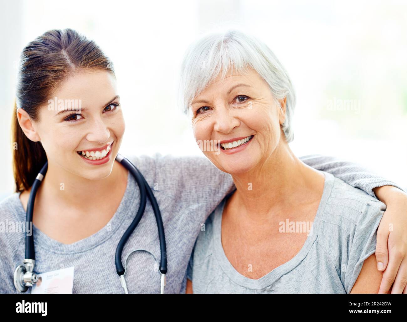 Retirement, happy portrait of caregiver and old woman in nursing home ...
