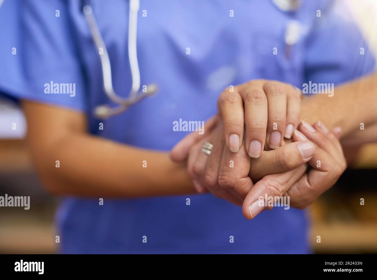Nurse, patient and holding hands for support, healthcare service and ...