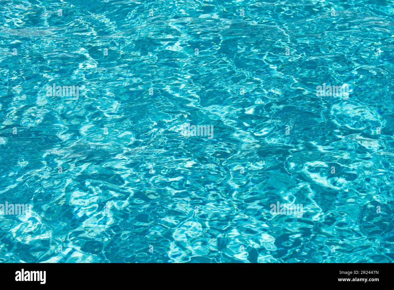 Background of blue water in swimming pool with sun reflection, ripple ...