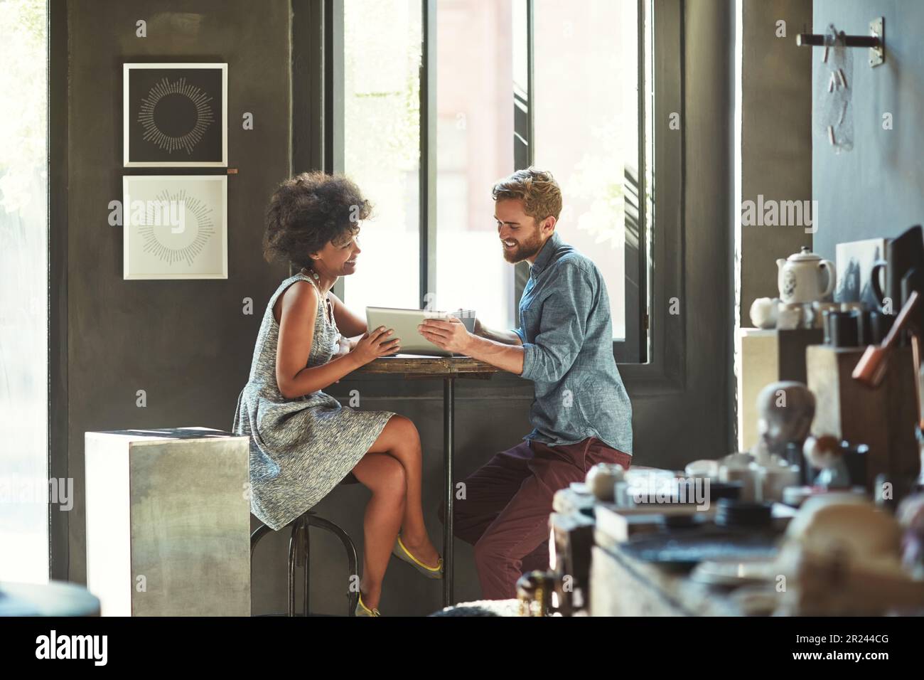 Coffee shop team, tablet and happy people reading online research ...