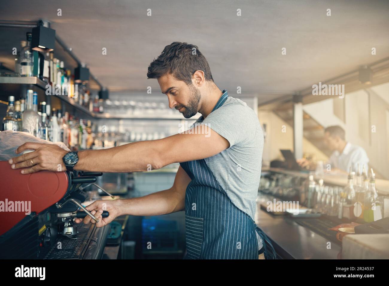 Man in cafe, coffee machine and barista, prepare caffeine drink order ...