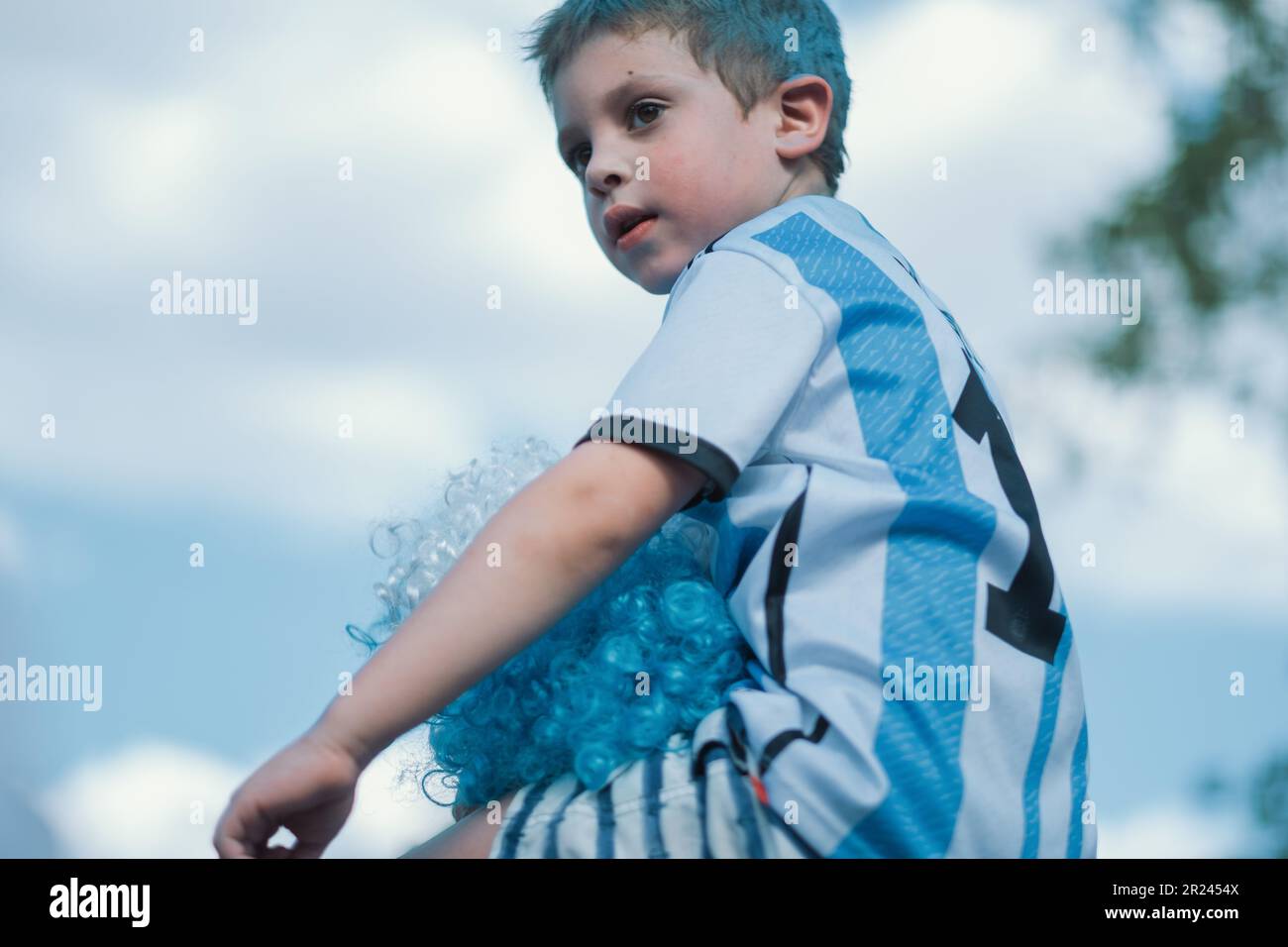 A young boy in Argentinian uniform at the celebration of the Fifa Qatar ...