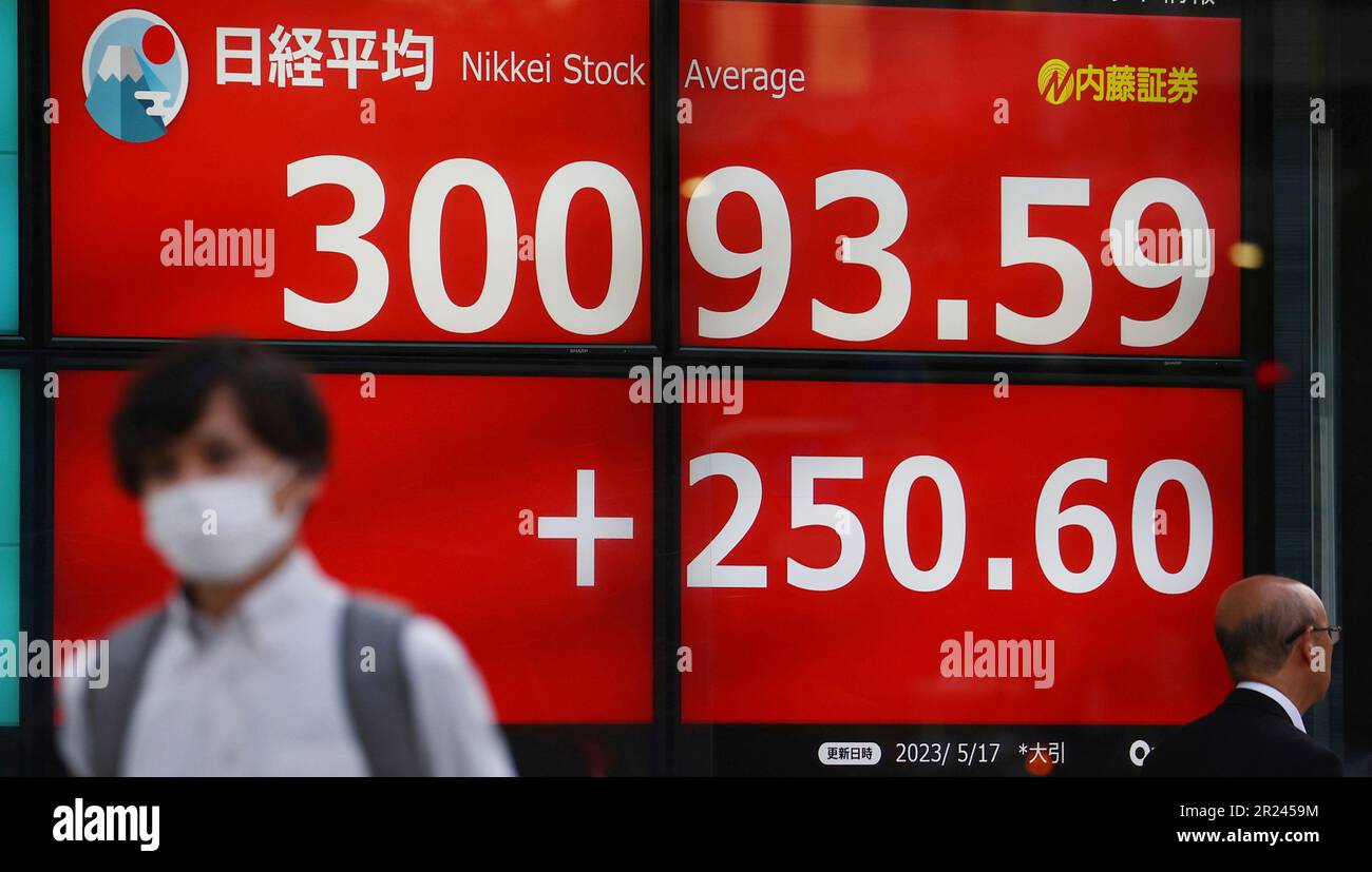 A monitor shows the Japan's Nikkei stock average exceeding above 30,000 yen level in Tokyo on ...