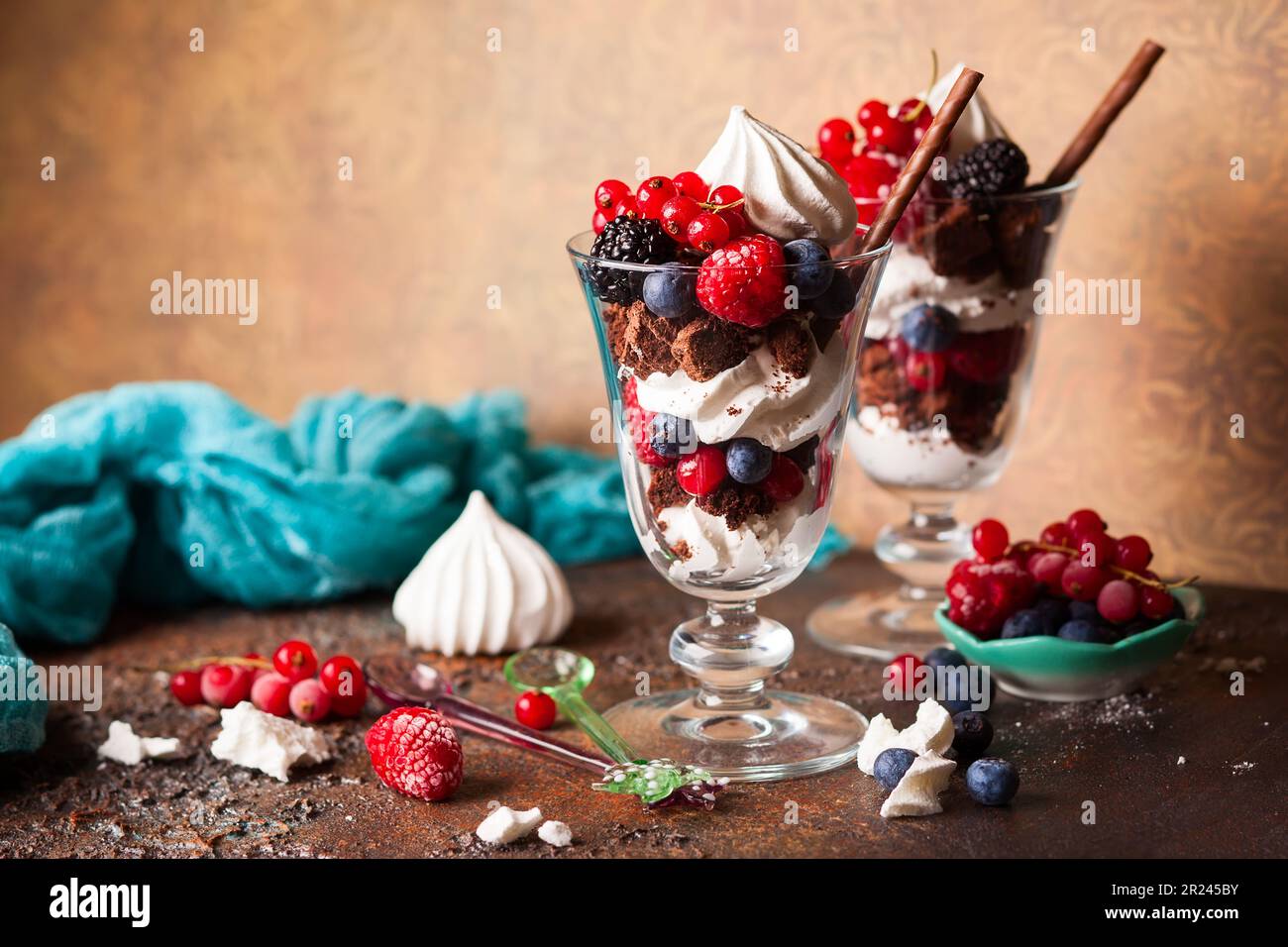 Chocolate brownies, fresh berries,meringue and whipped cream layered in ...