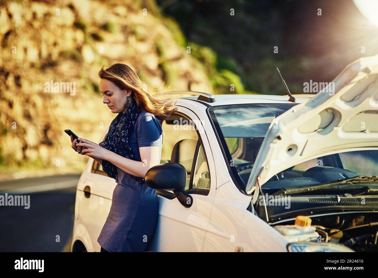Breakdown on road trip, car and woman with phone to search for help ...