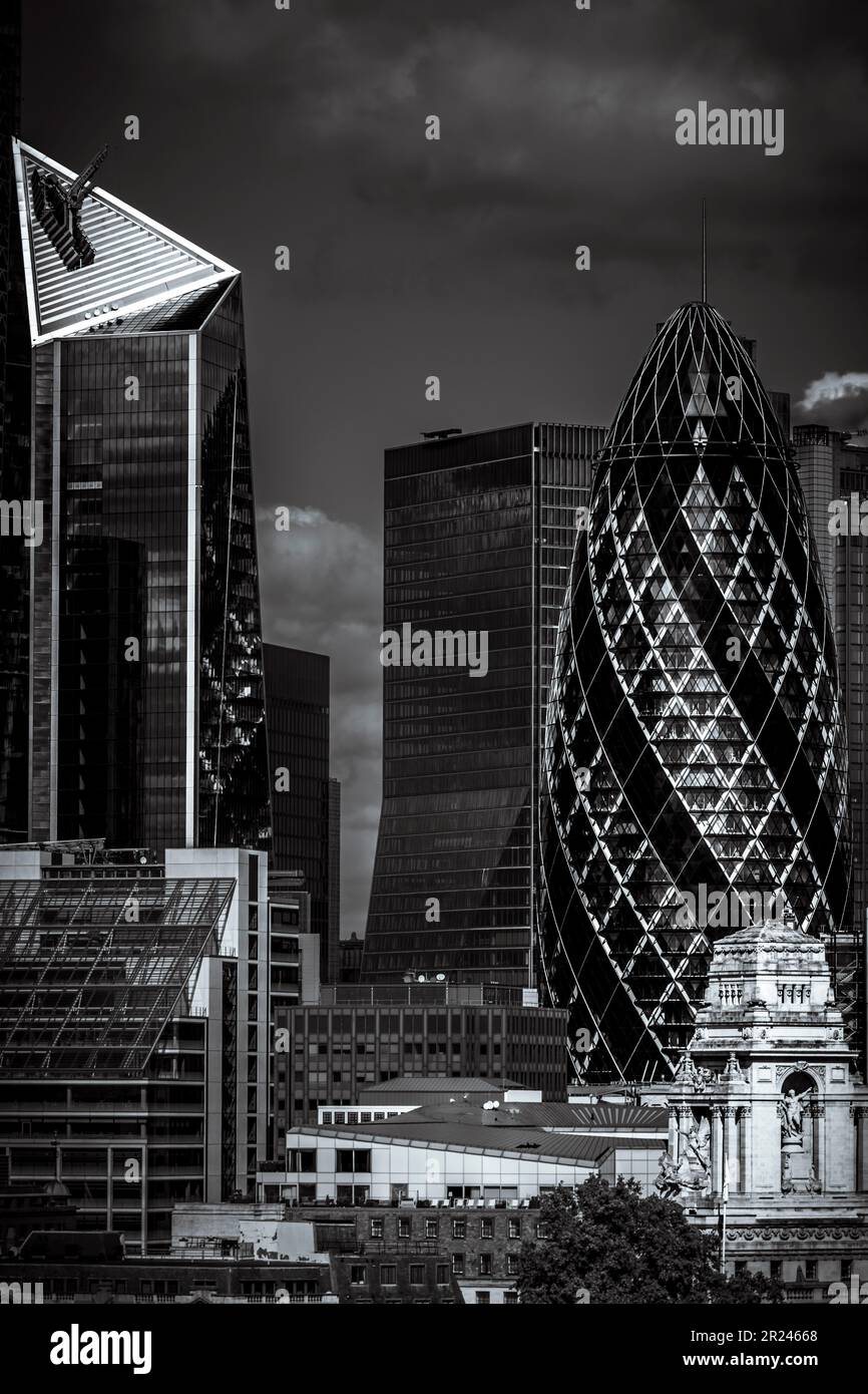 A vertical grayscale shot of a cityscape with high-rise buildings in ...