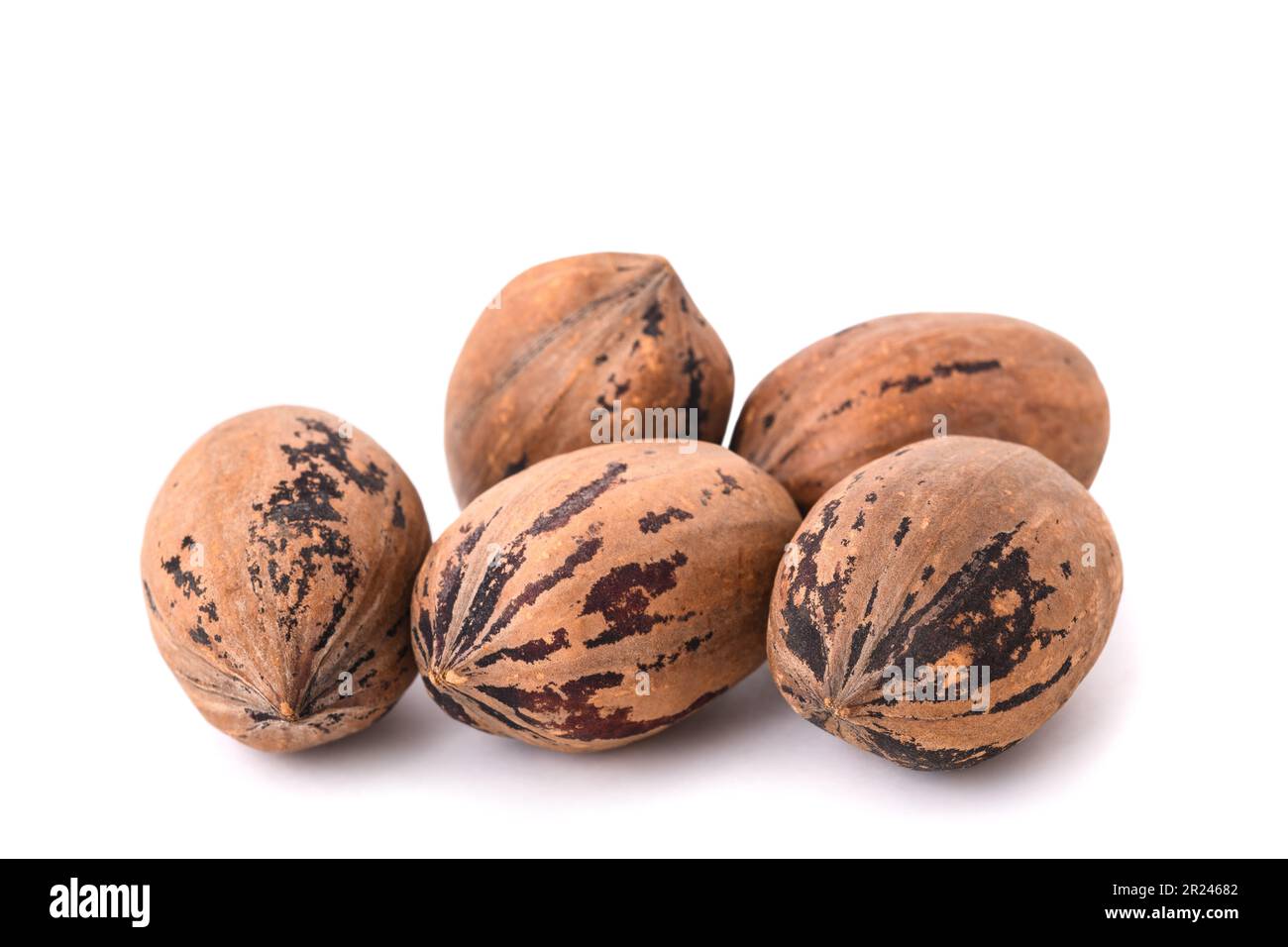 Pecan nuts group isolated on white background Stock Photo - Alamy