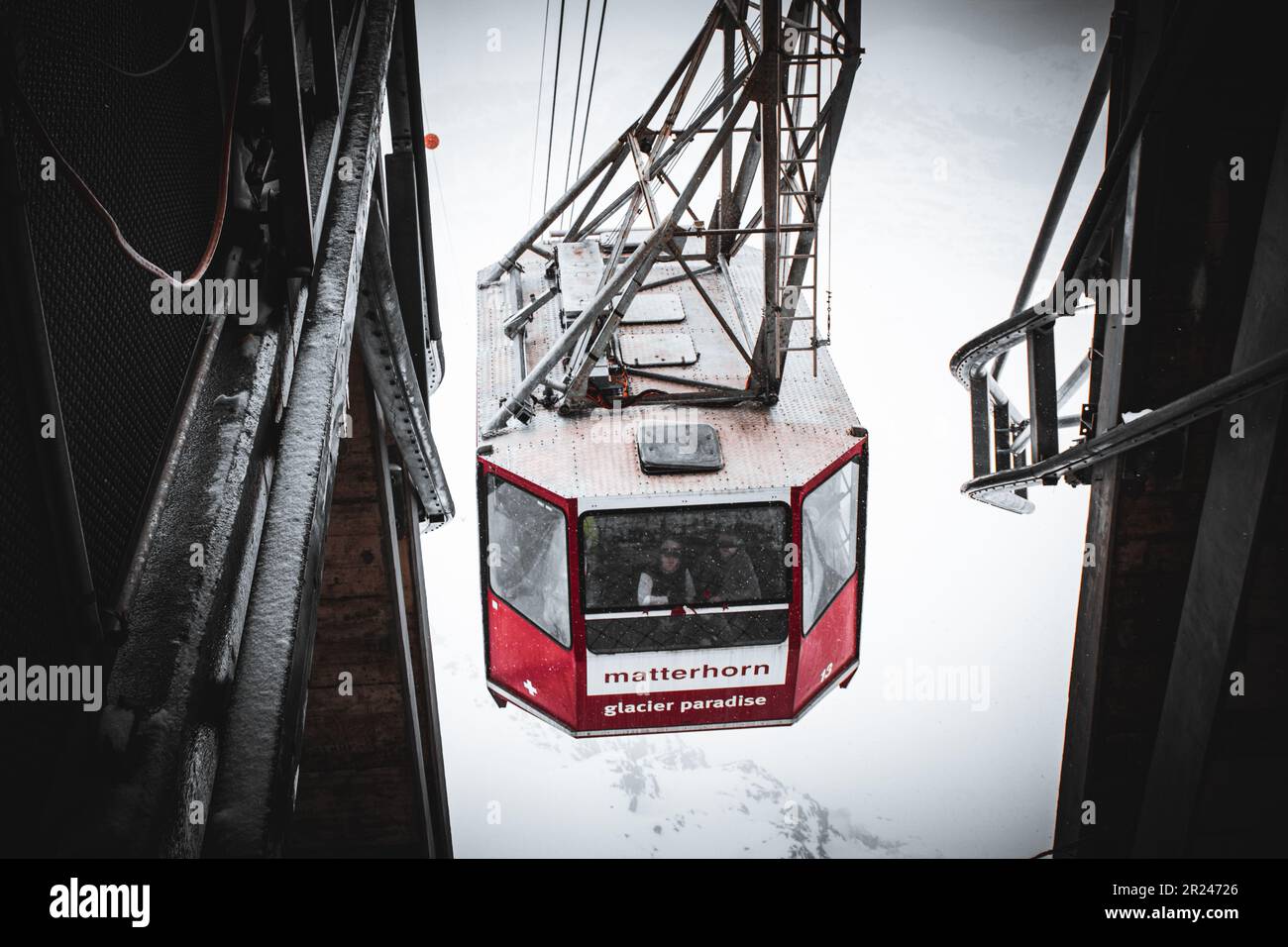 A majestic gondola ascends the Matterhorn Glacier Paradise, nestled ...