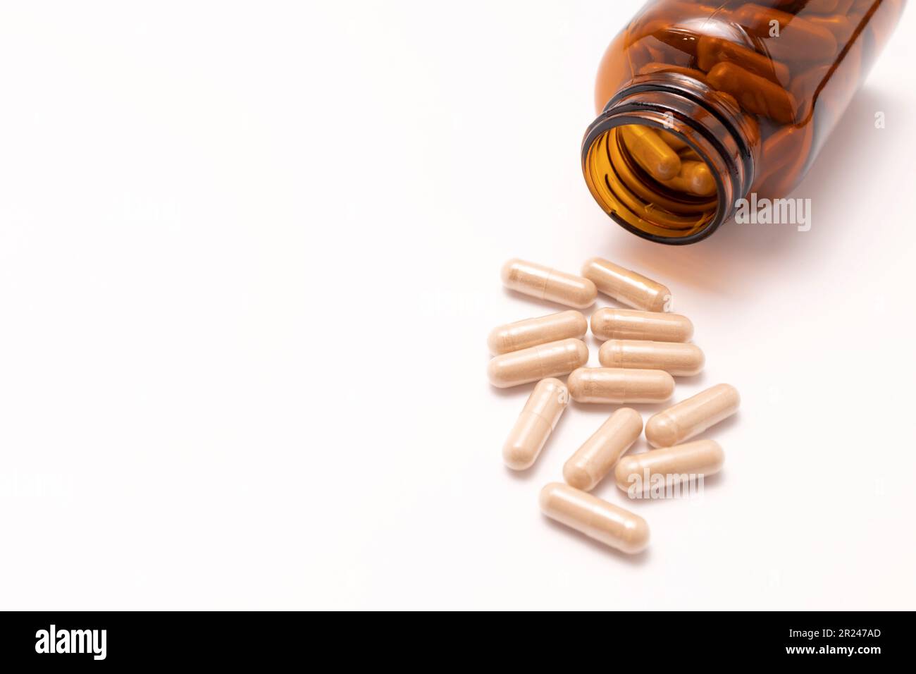 View From Above Capsules OF Slippery Elm, Brown Glass Bottle On White ...