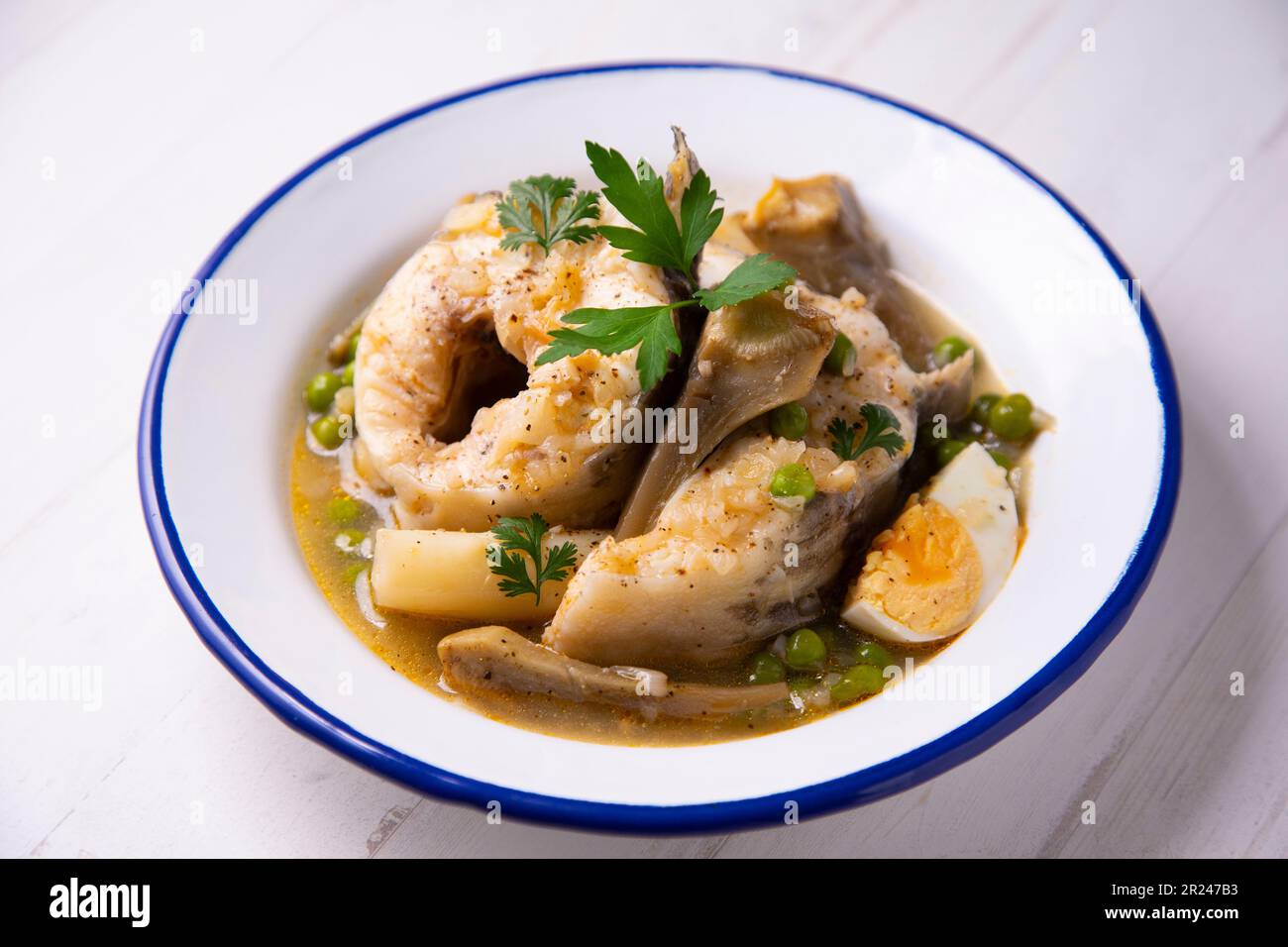 Conger eel stew cooked with hard-boiled egg, artichokes and peas Stock ...