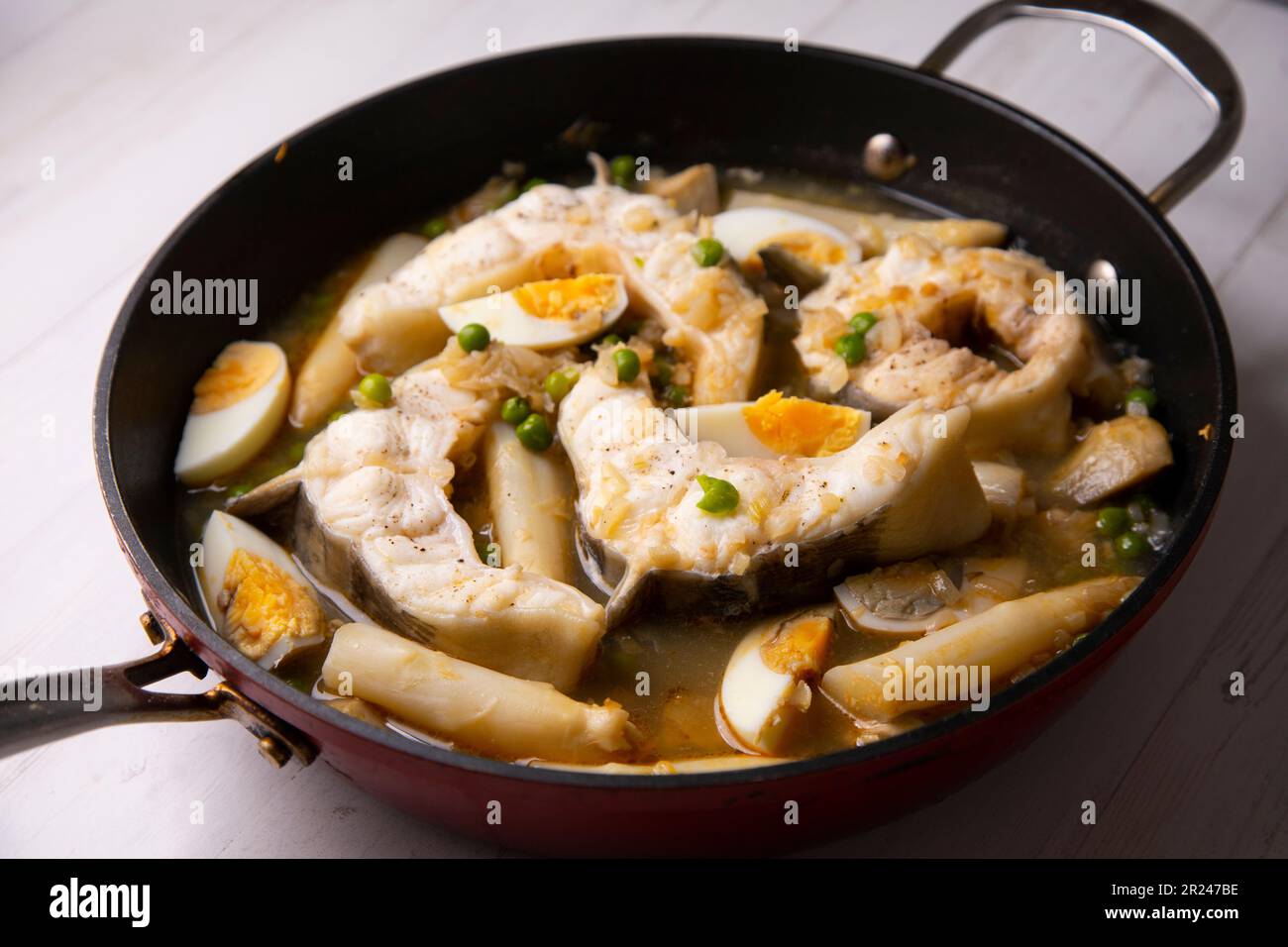 Conger eel stew cooked with hard-boiled egg, artichokes and peas Stock ...