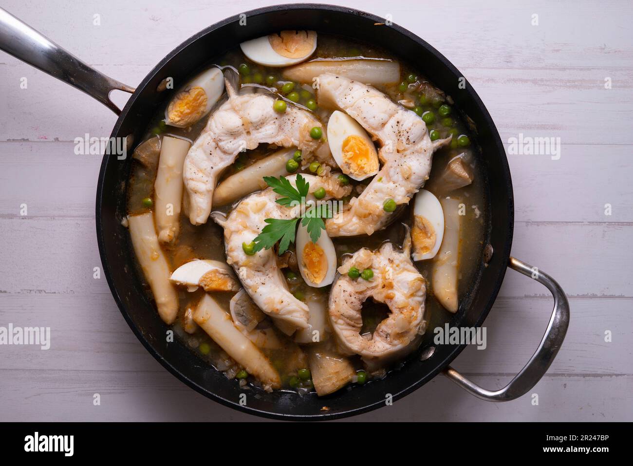 Conger eel stew cooked with hard-boiled egg, artichokes and peas Stock ...