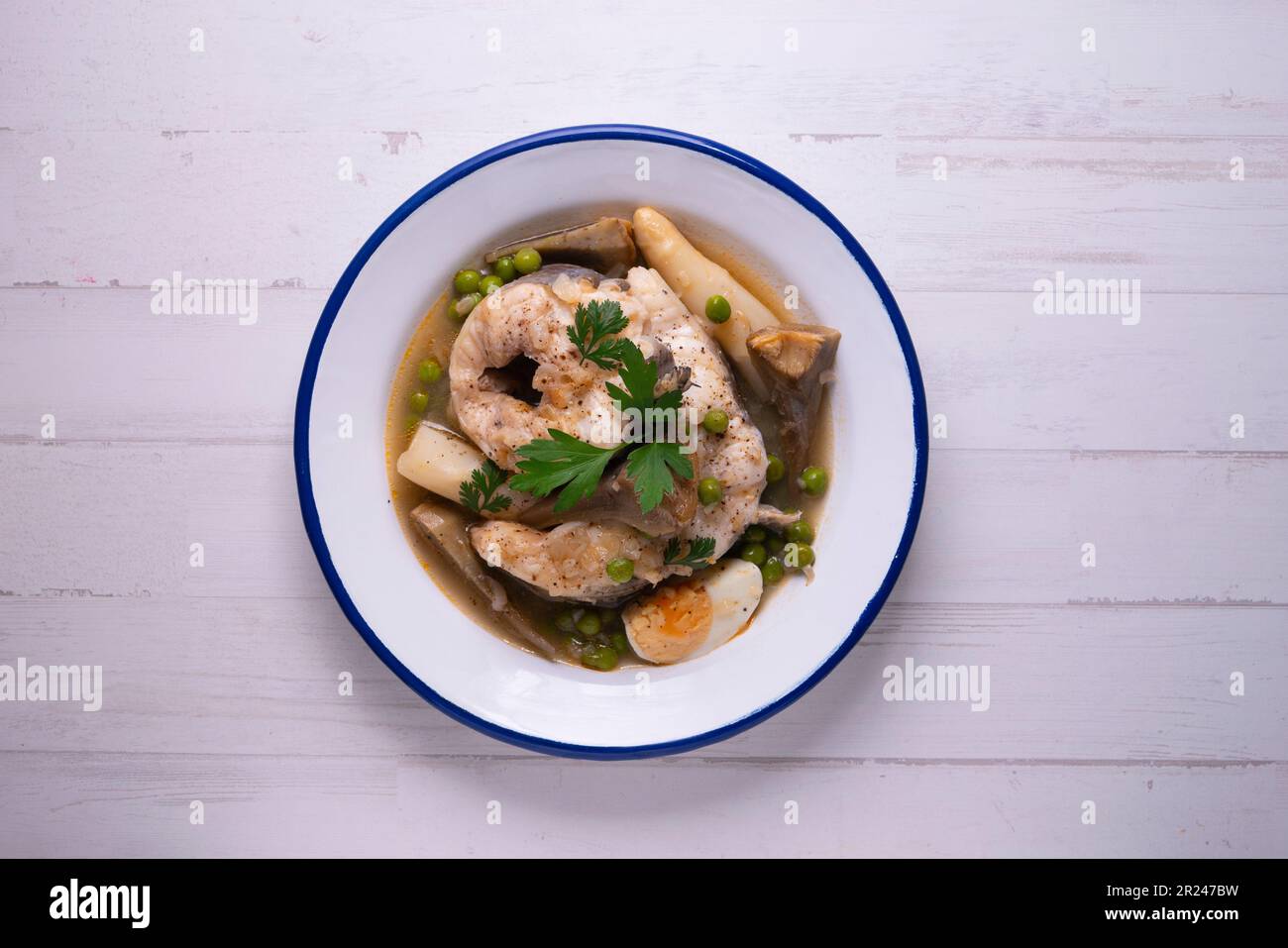 Conger eel stew cooked with hard-boiled egg, artichokes and peas Stock ...