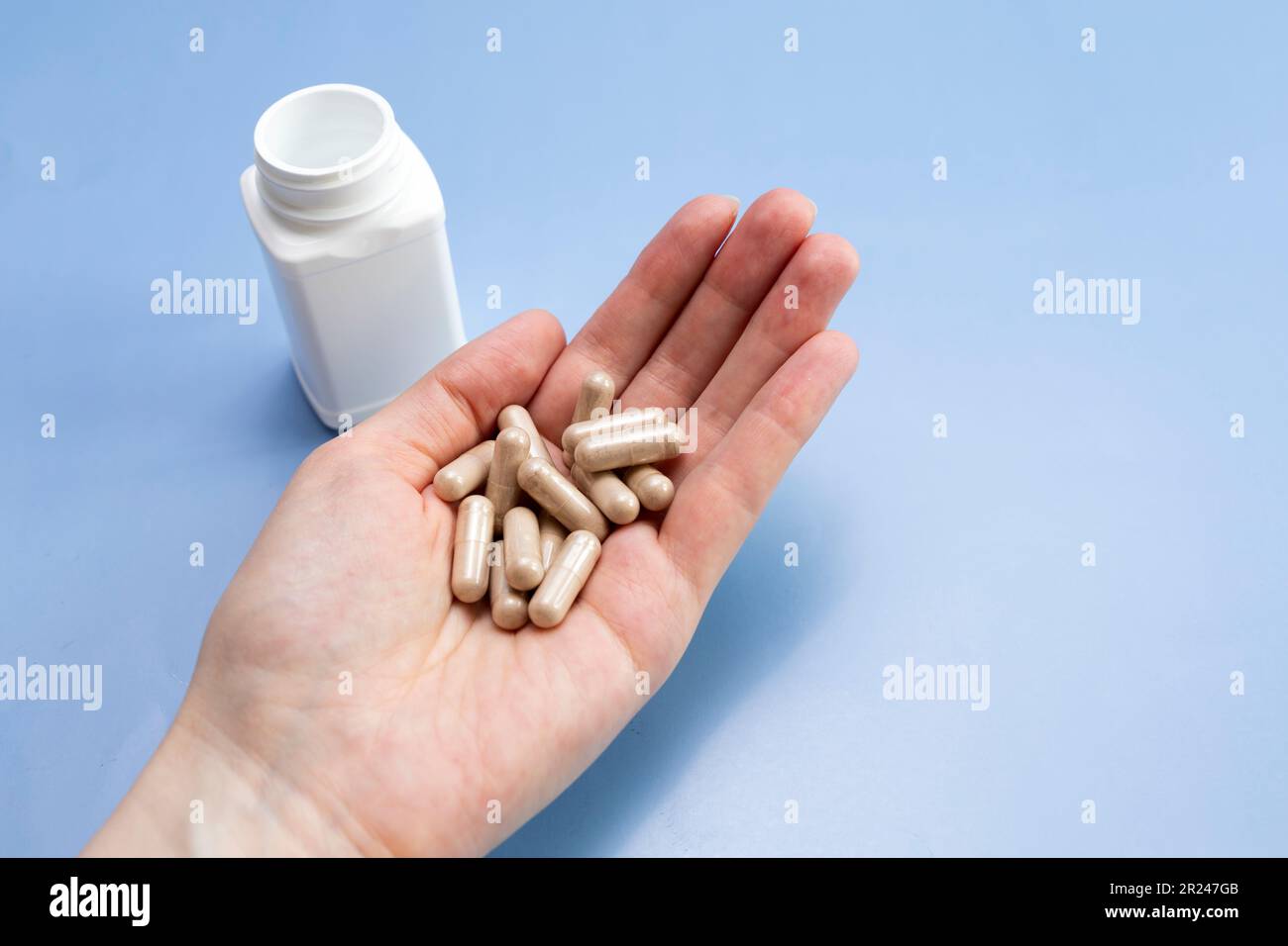 A Handful Of Pills, Softgel Capsules Of Slippery Elm On Human Hand ...