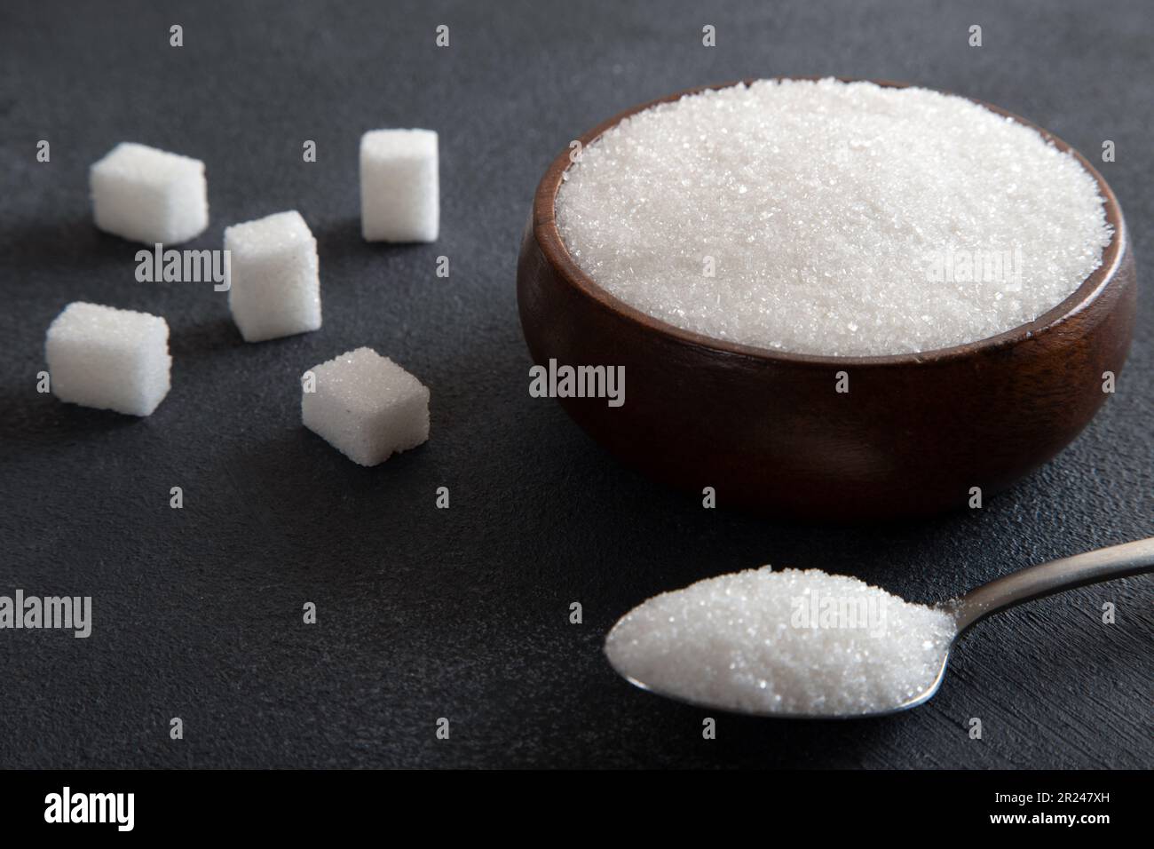 Cube sugar and granulated sugar on black background,top view Stock ...