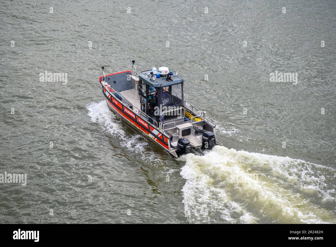 DUISBURG, GERMANY - MAY 12, 2023: Small fire department boat arriving ... DUISBURG, GERMANY - MAY 12, 2023: Small fire department boat arriving ...