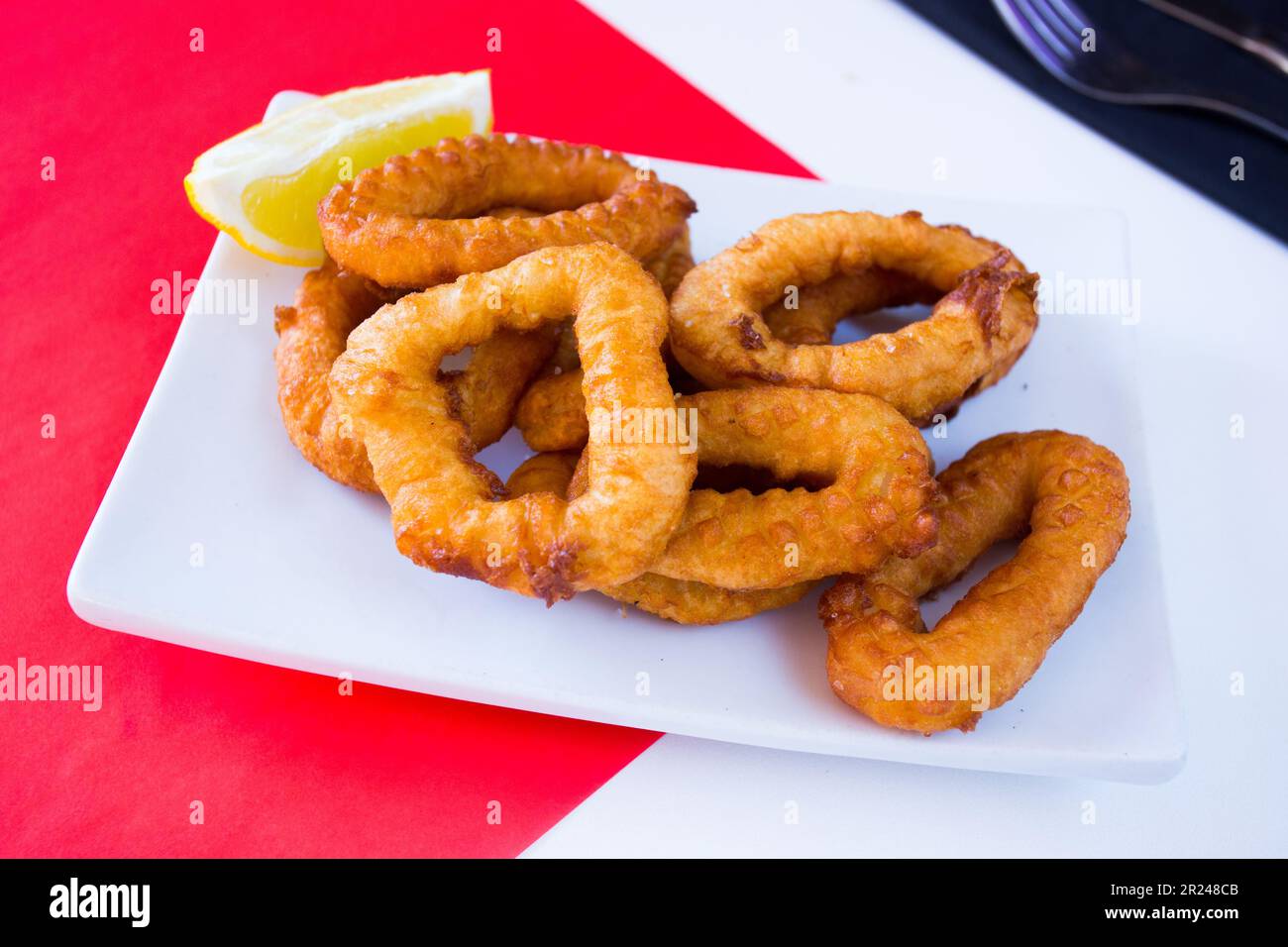 Spanish tapa of squid rings Roman style Stock Photo - Alamy