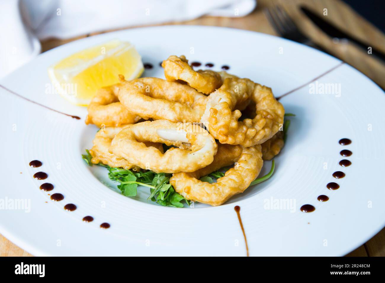 Spanish tapa of squid rings Roman style Stock Photo - Alamy