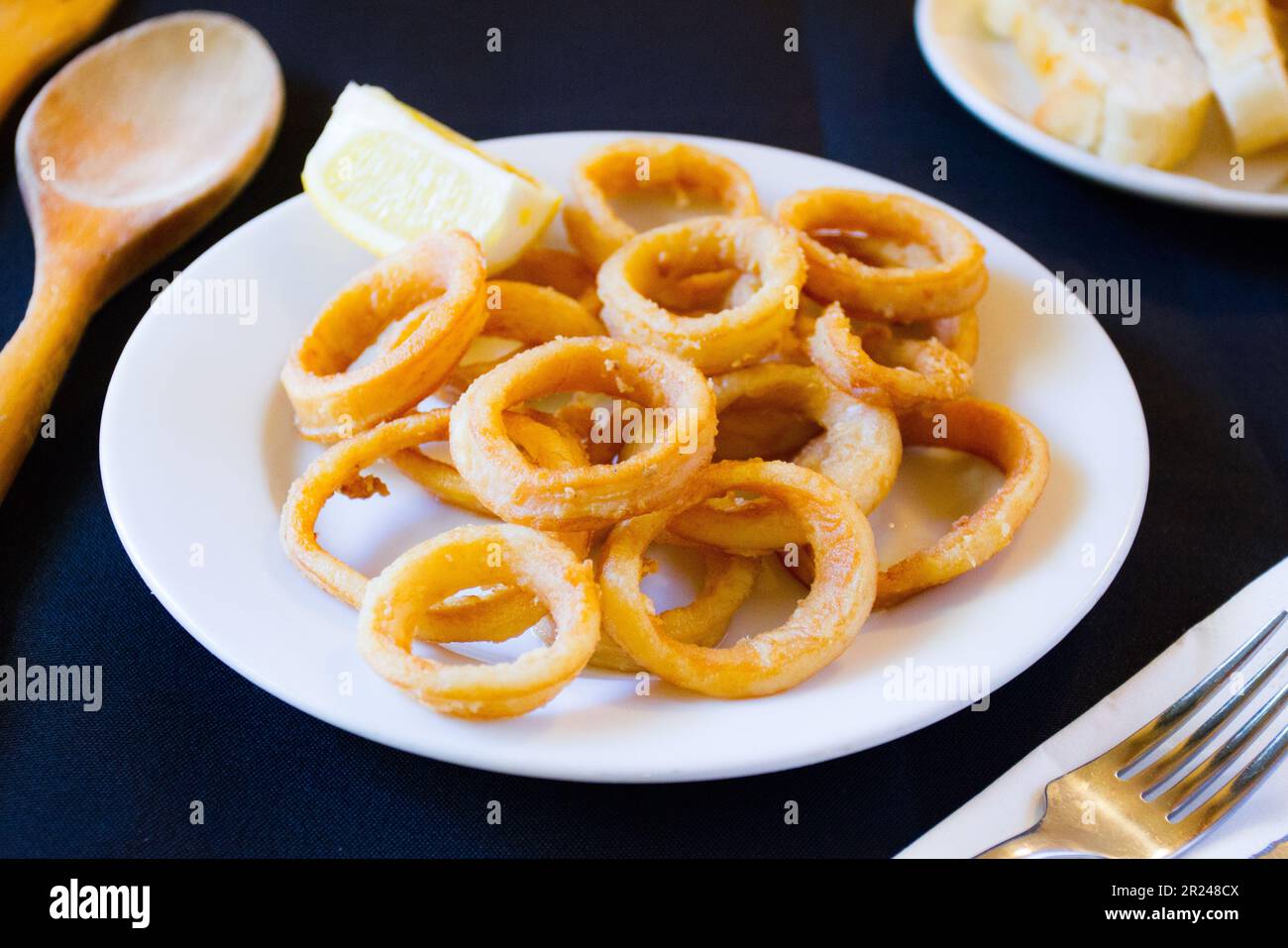Spanish tapa of squid rings Roman style Stock Photo - Alamy