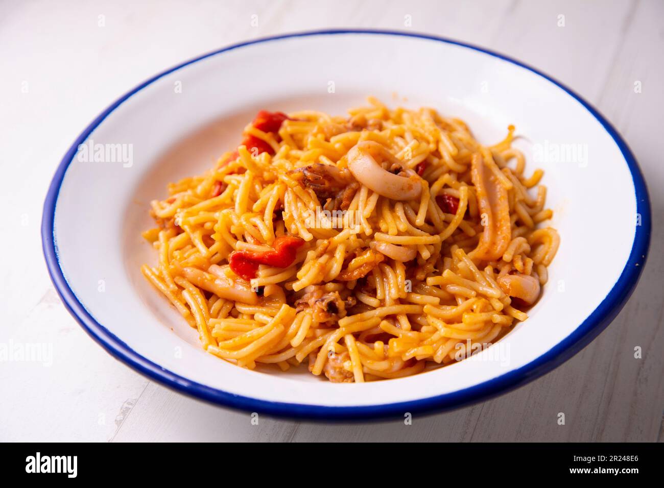 Fideua paella with squid. Traditional Spanish recipe Stock Photo - Alamy