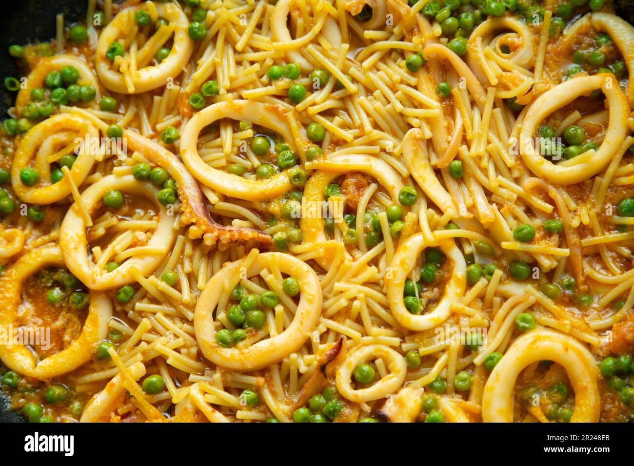 Fideua paella with squid. Traditional Spanish recipe Stock Photo - Alamy