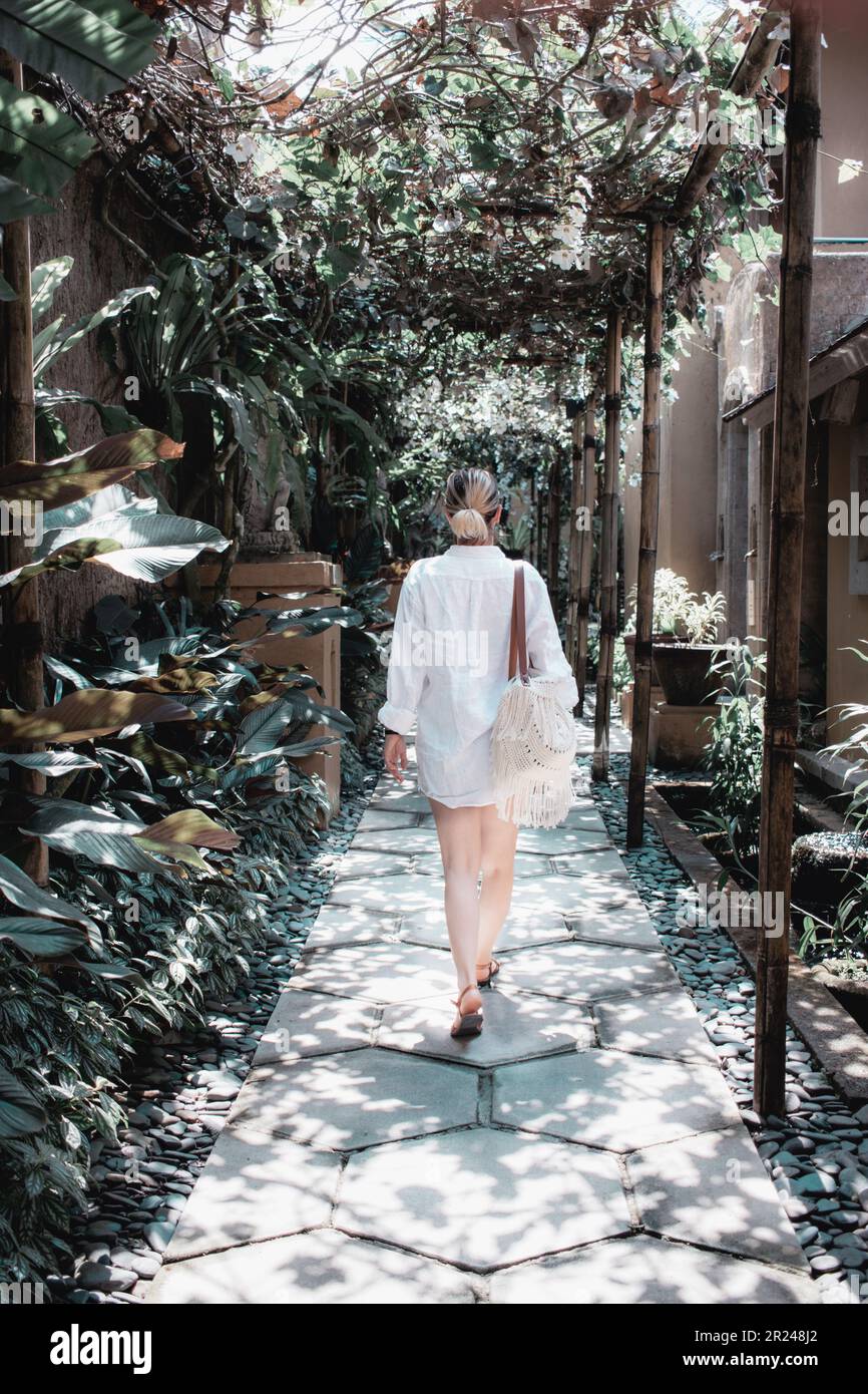 girl walking away through jungle Stock Photo - Alamy
