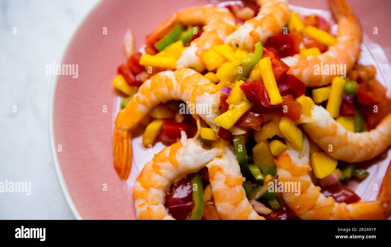 Prawn tail salad with colored peppers and mango Stock Photo - Alamy