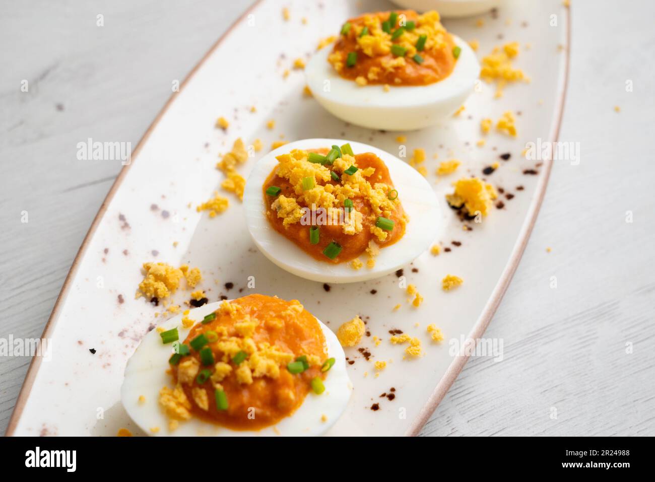 Eggs stuffed with tuna and tomato cream. Traditional Spanish tapa ...