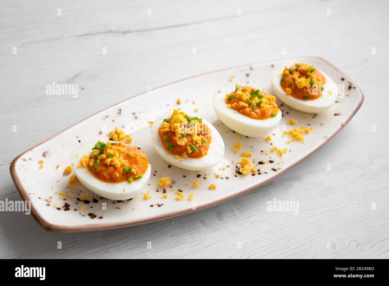 Eggs stuffed with tuna and tomato cream. Traditional Spanish tapa ...