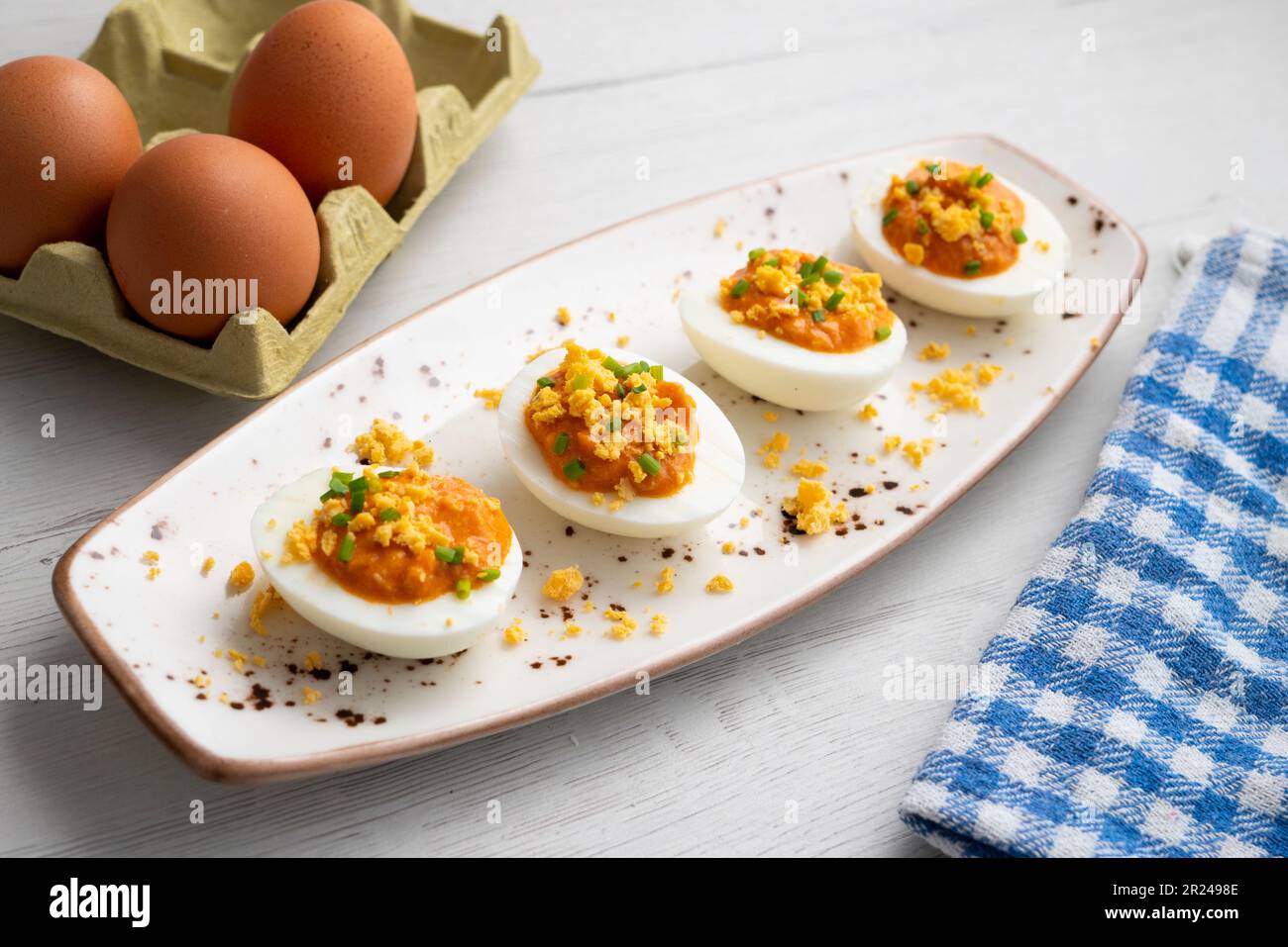 Eggs stuffed with tuna and tomato cream. Traditional Spanish tapa ...