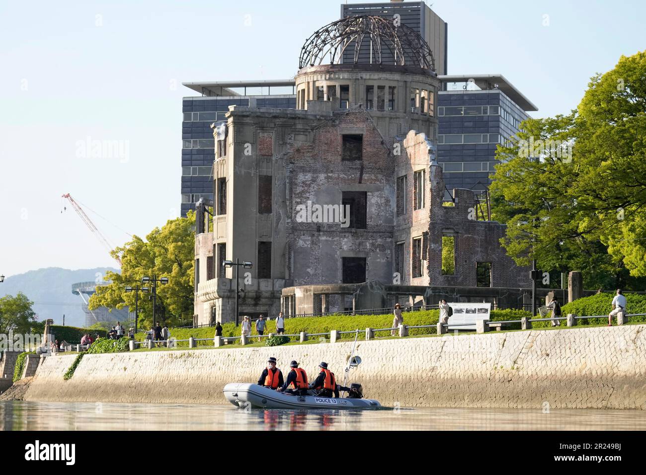 Police officers patrol on the river near the famed Atomic Bomb Dome as ...