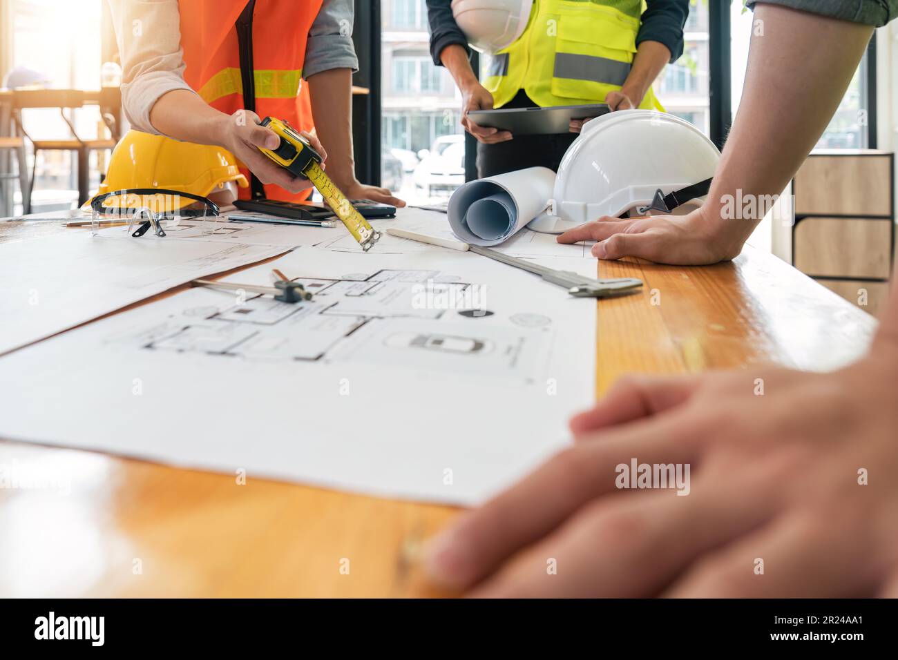 engineer people meeting working and pointing at a blueprint in office ...