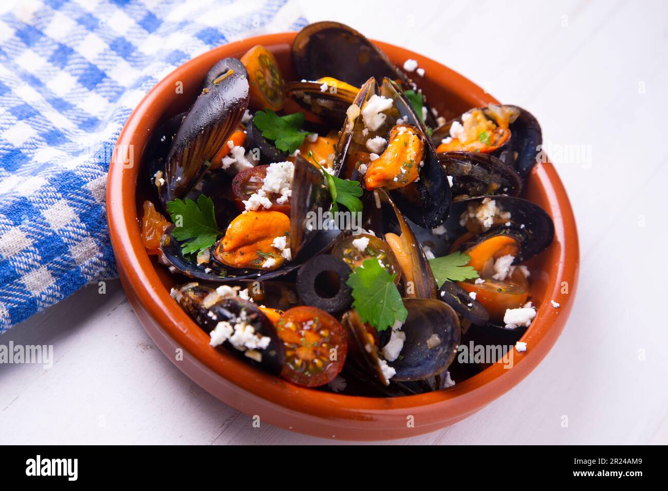 Steamed mussels with vegetables and sauce. Traditional Spanish tapa ...