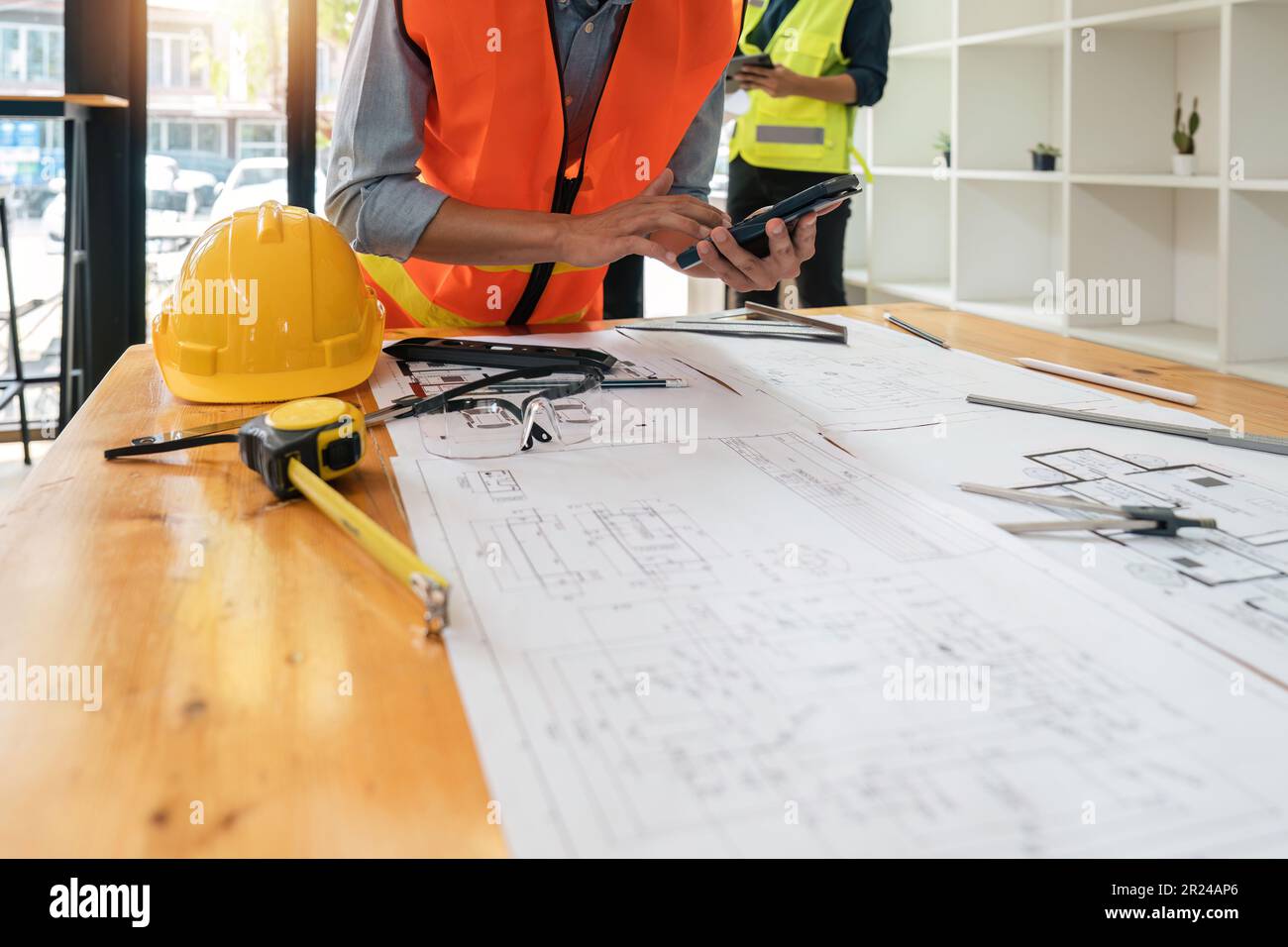 engineer working in office with blueprints, inspection in workplace for ...