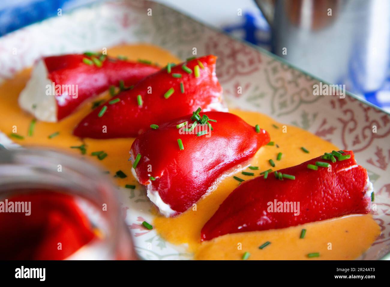 Piquillo red peppers stuffed with cream cheese and seafood. Traditional ...